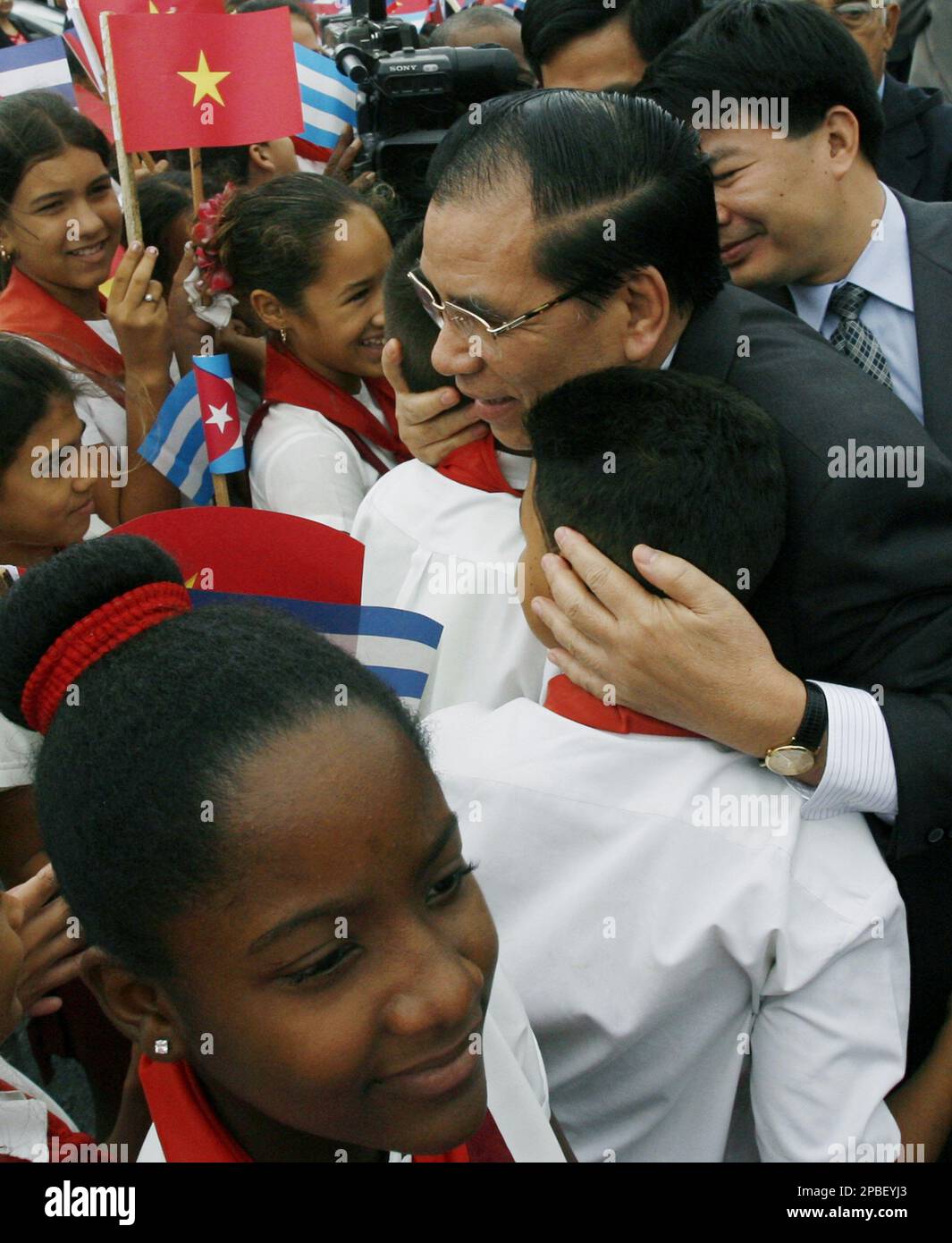 Nong Duc Manh, General Secretary of Vietnam's Communist Party, right ...