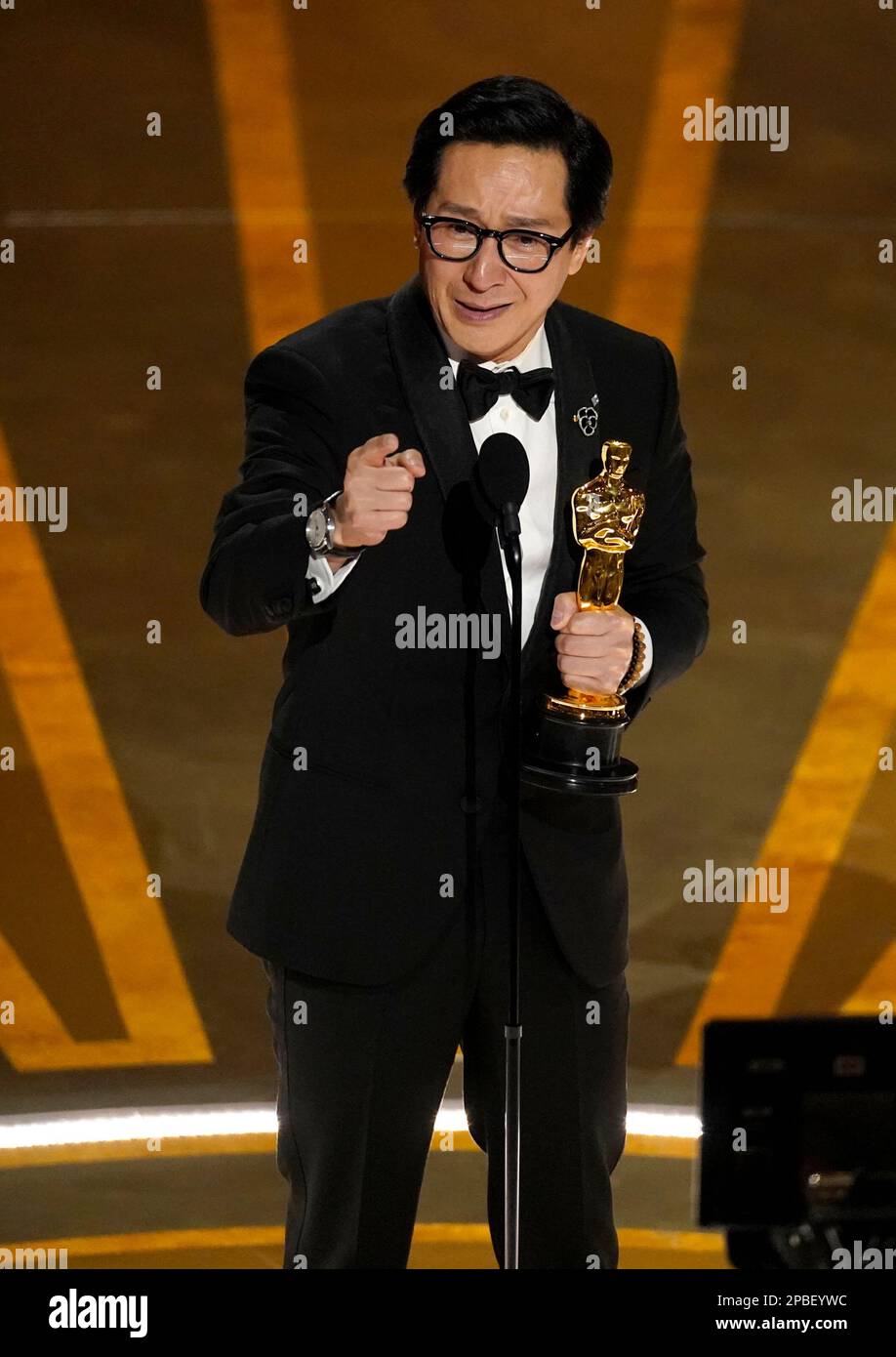 Ke Huy Quan accepts the award for best performance by an actor in a ...