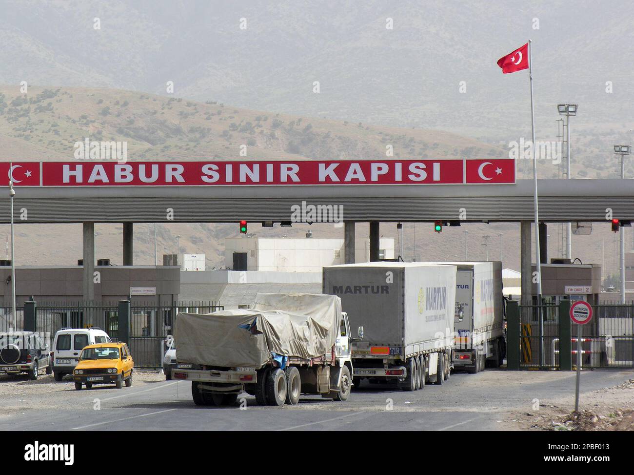 Turkish trucks crossing the Habur border gate near southeastern Turkish ...