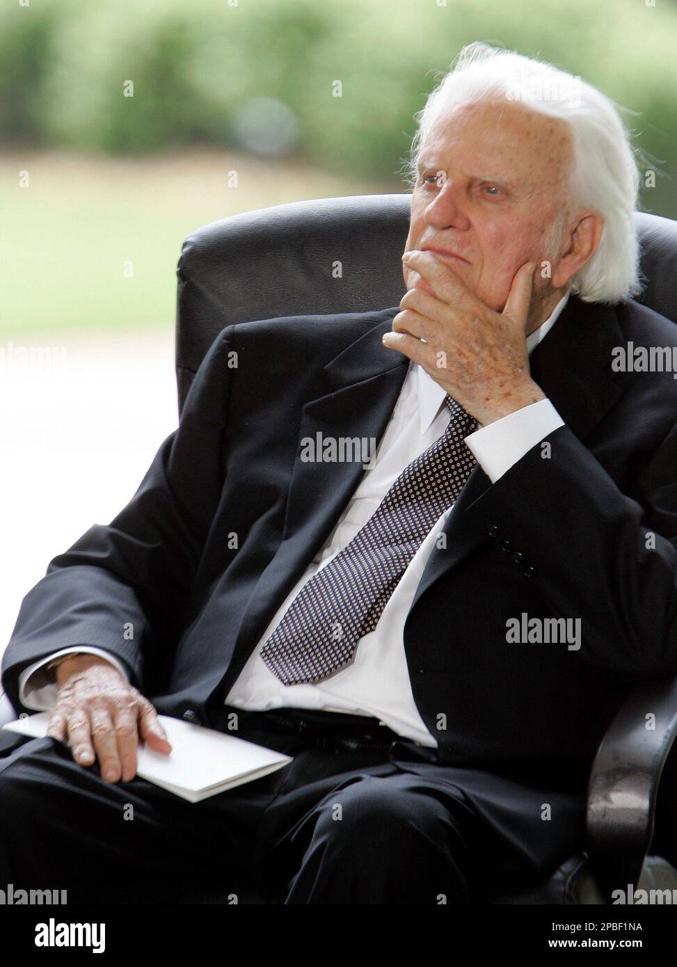 Billy Graham listens during a dedication ceremony for the Billy Graham ...