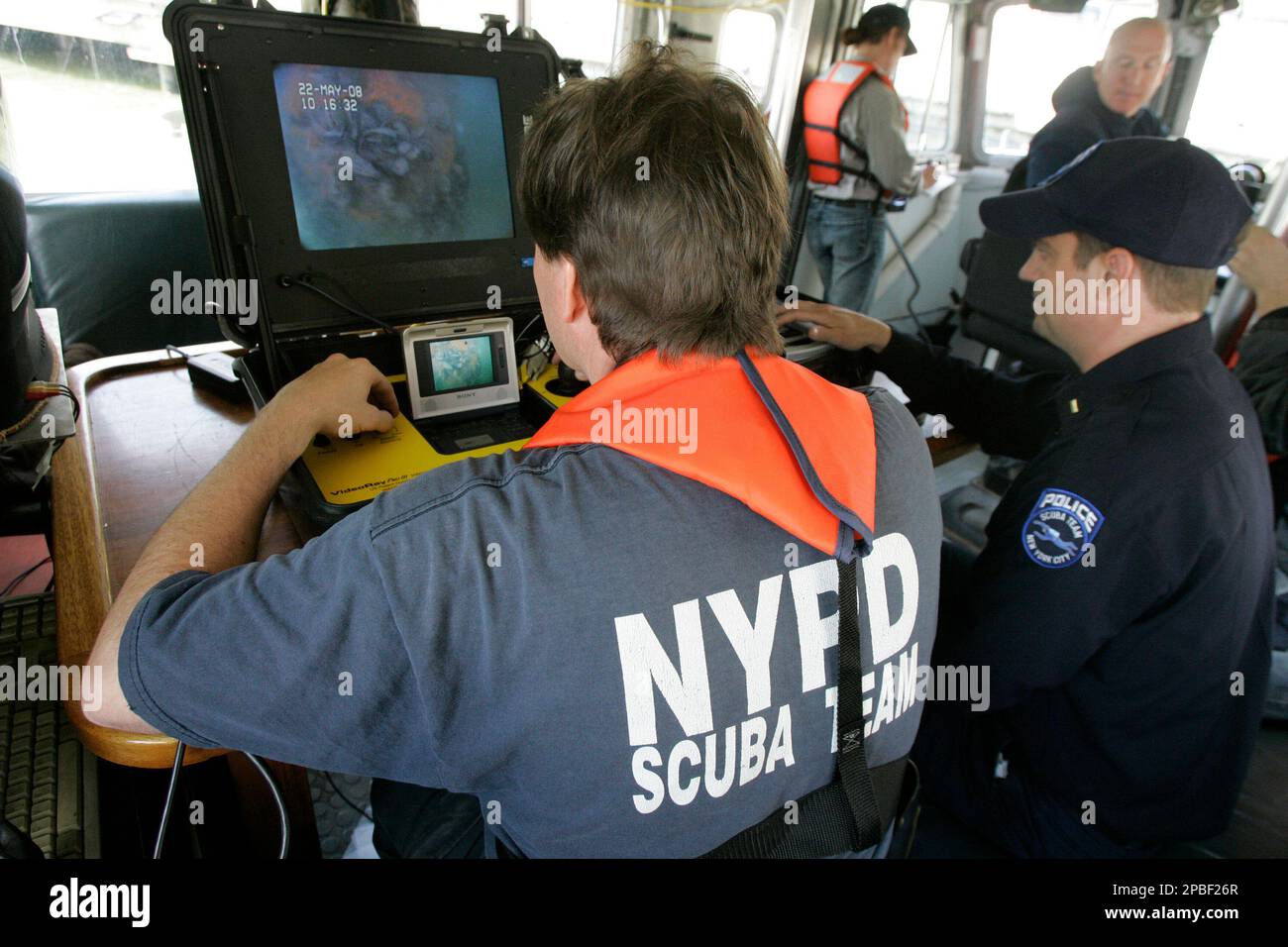 Det. Liam Devine, left, a member of the of the New York City Police ...