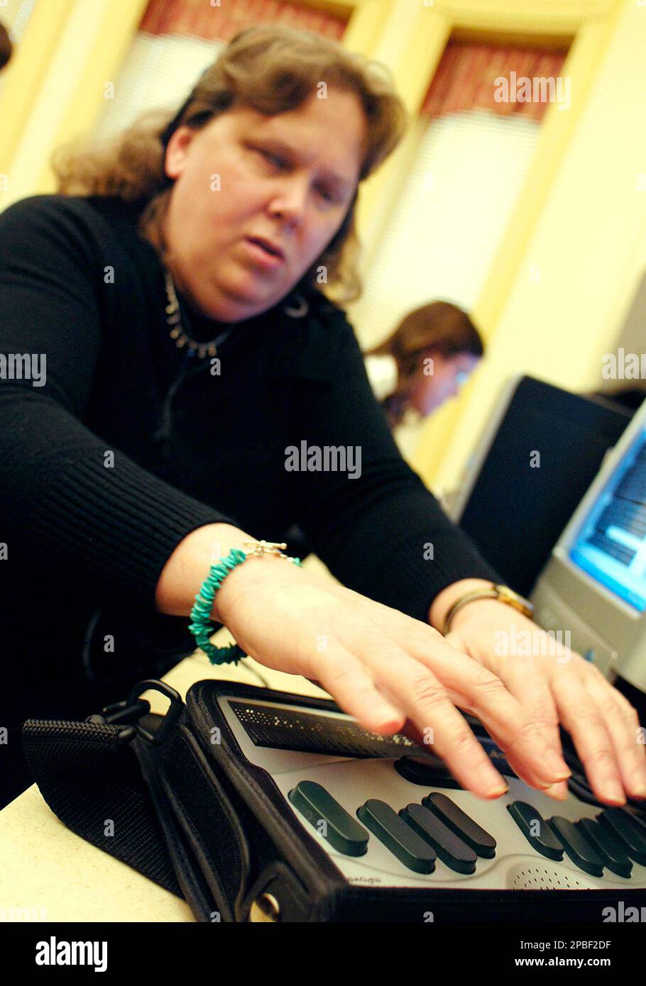 ** ADVANCE FOR SUNDAY, JUNE 3 ** Susan Hall takes notes on her Braille ...