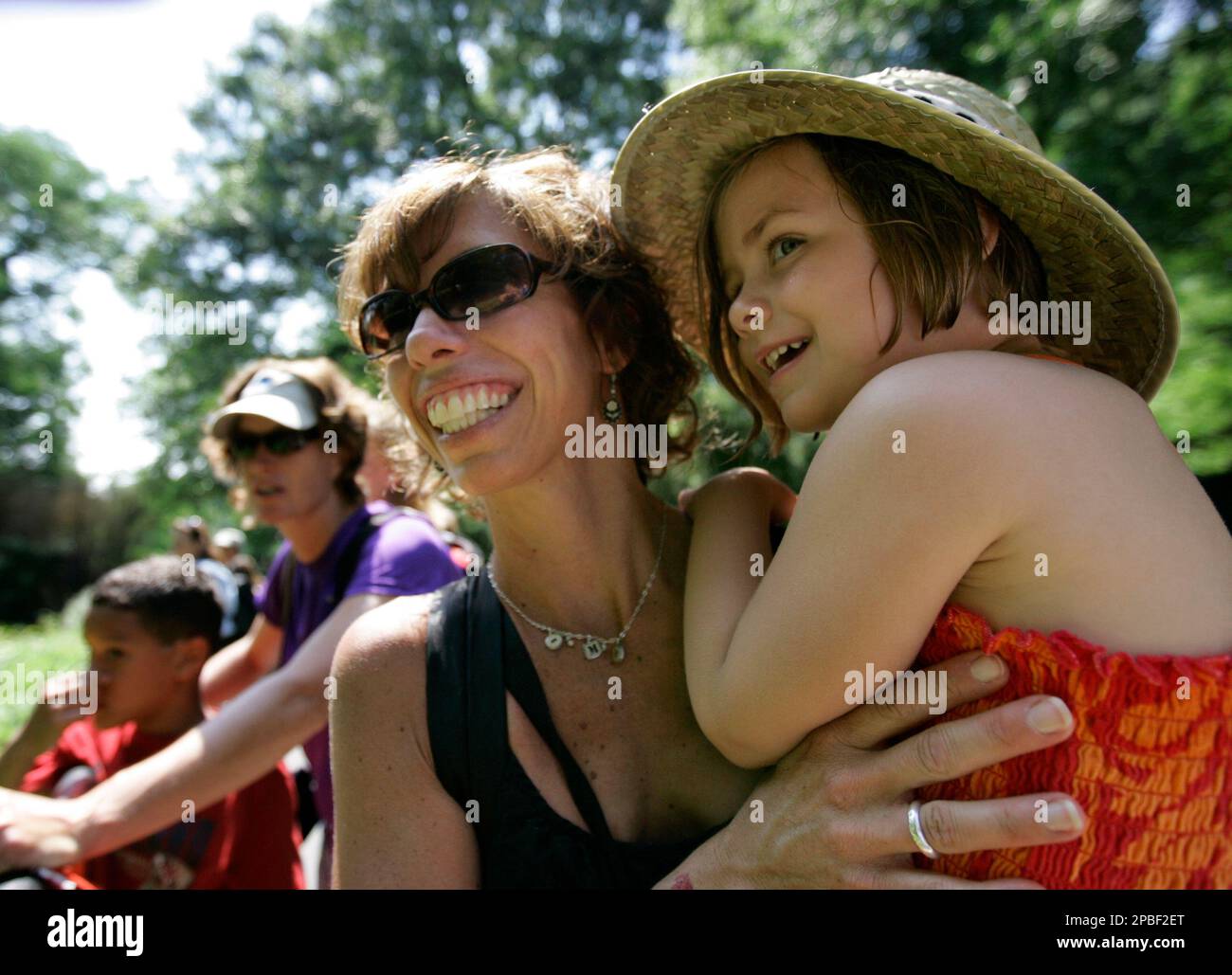 Kerry Monahan and her daughter Ellen, 4, watch as three new male ...