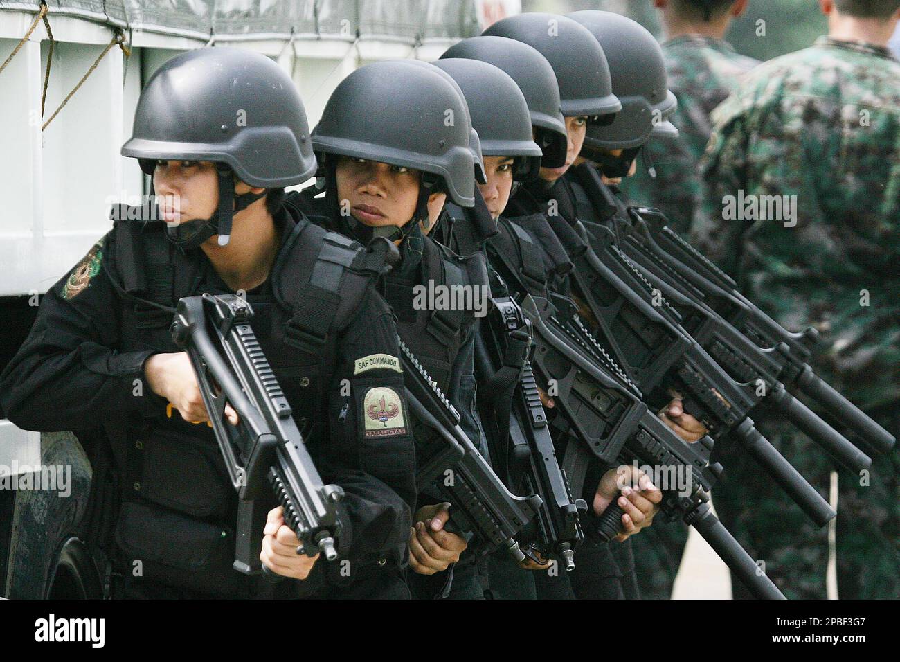 Philippine female police officers of the Special Action Force prepare ...