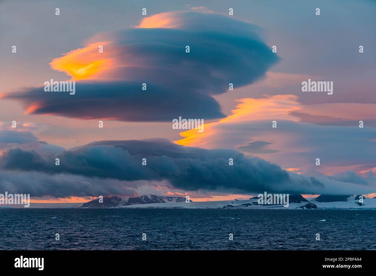 Mountains along the Bransfield Straight in Antarctica are draped in ...