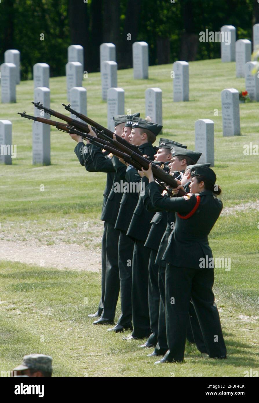 Members of the Spaulding High School Jr. ROTC give a 21-gun salute ...