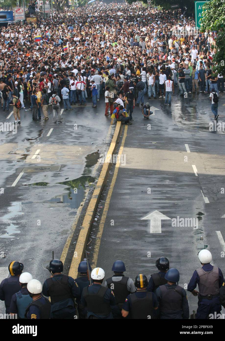 Riot police stand on guard in Caracas, Tuesday, May 29, 2007, after ...