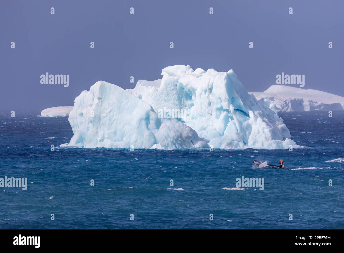 Icebergs floating on the open sea in Antarctica reflecting their blue ...