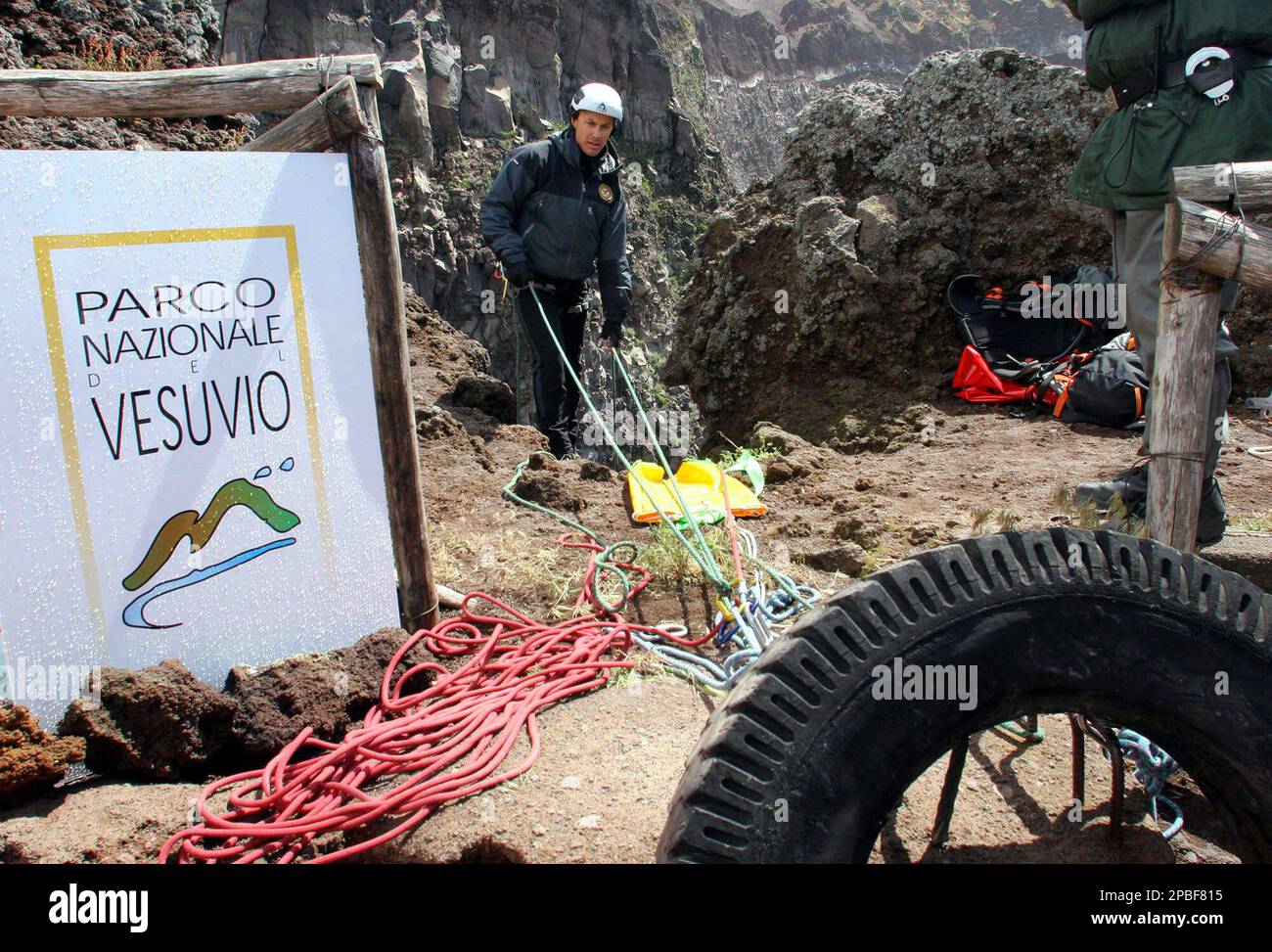 Italian forest rangers pull tyres out of from a crater in the Mount ...