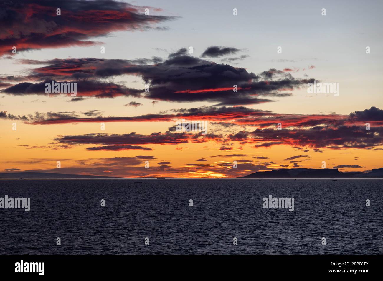 Brilliant clouds reflecting magenta colors from the sun as it gets ...