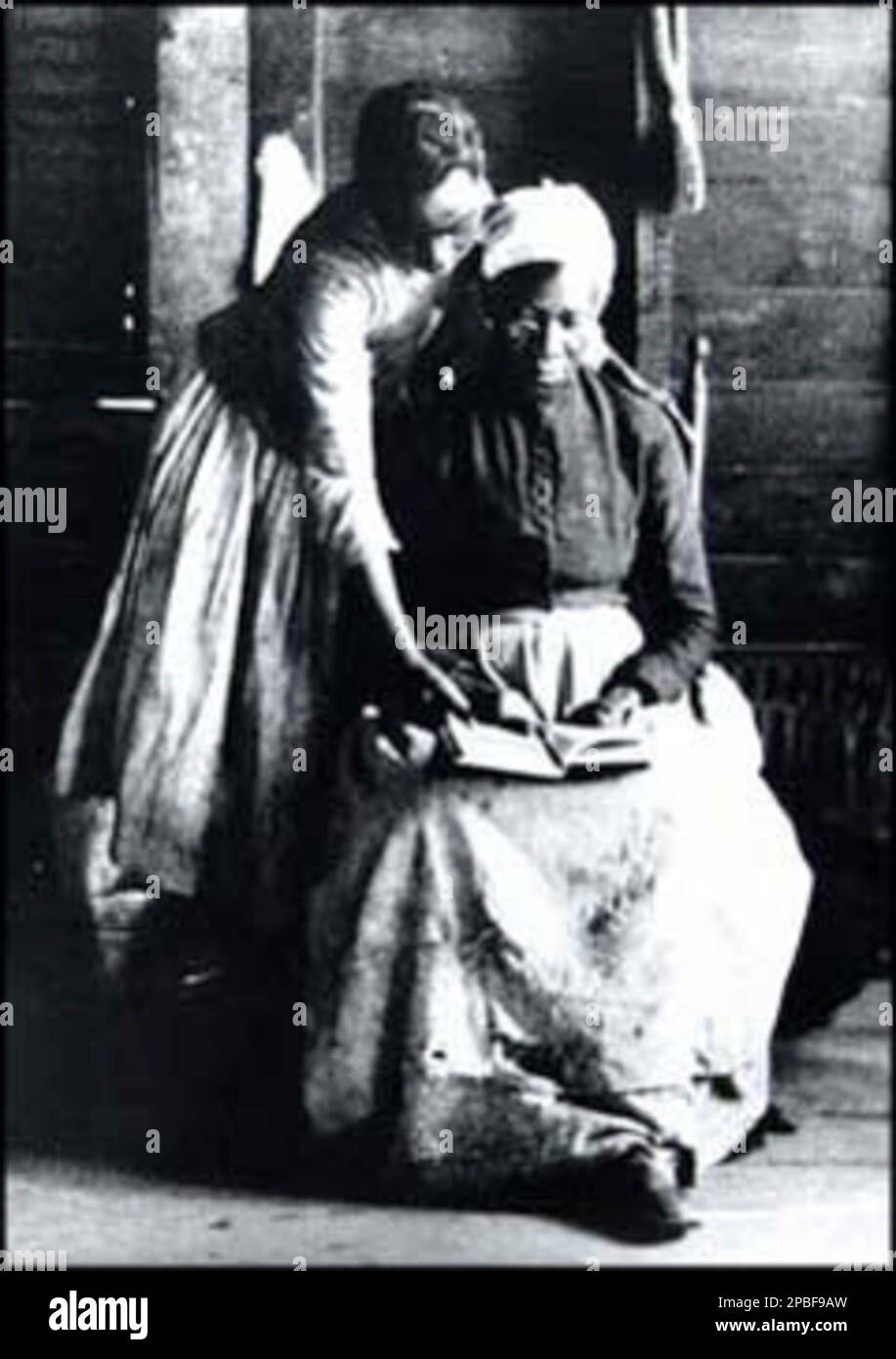 Former slave reading, 1870 Stock Photo - Alamy