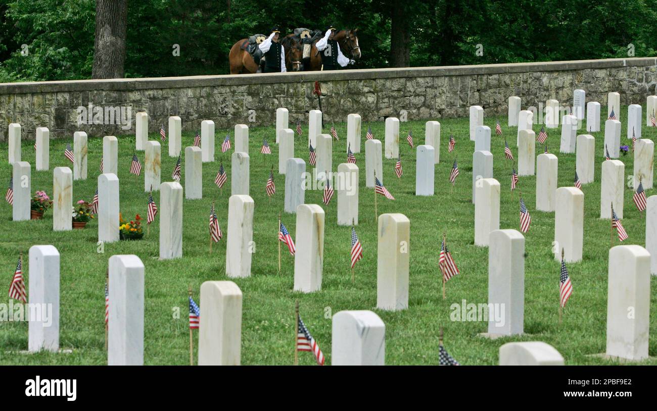 Members of the Commanding General's Mounted Color Guard salute during ...