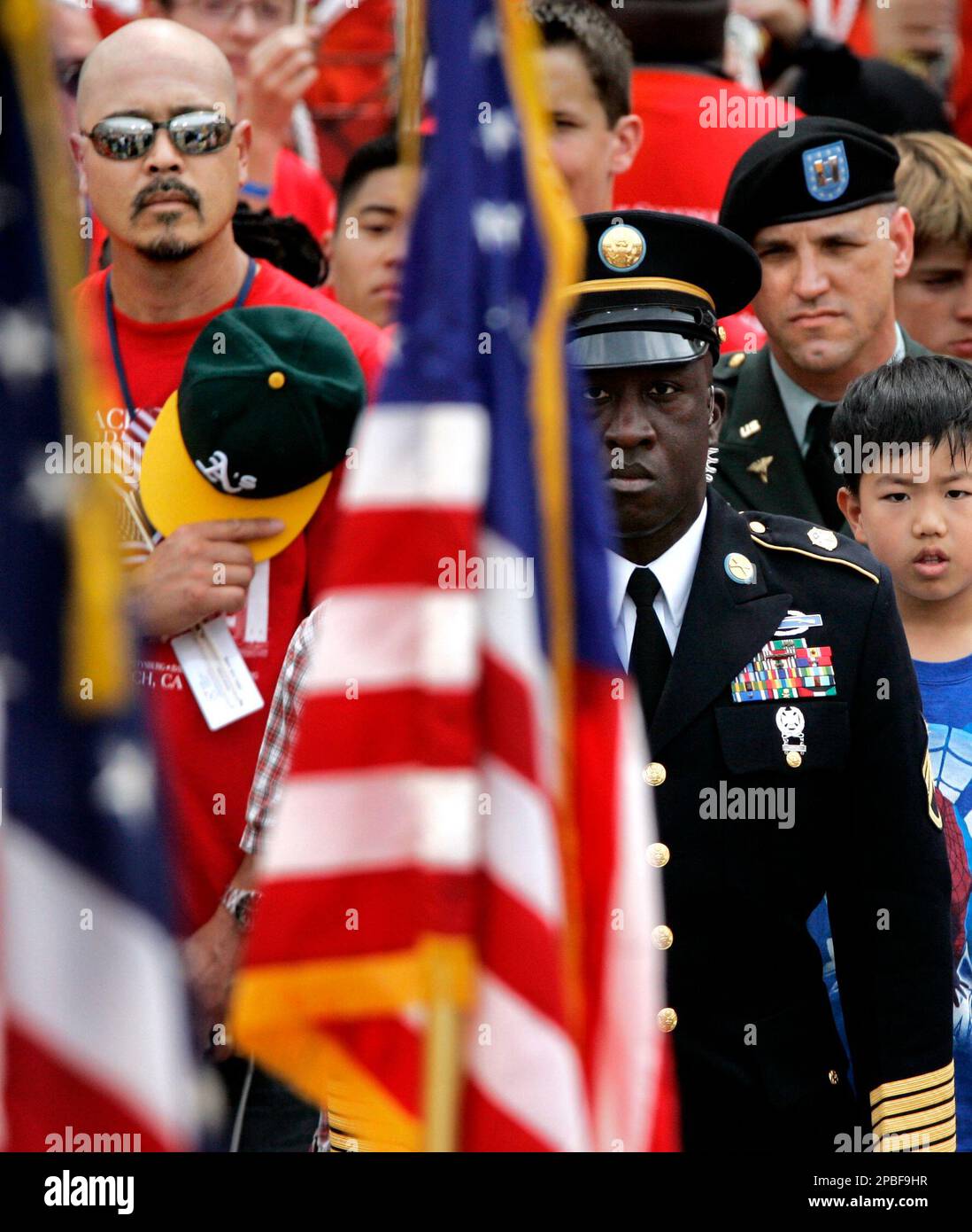 All eyes are focused on the American flag as the colors are carried ...