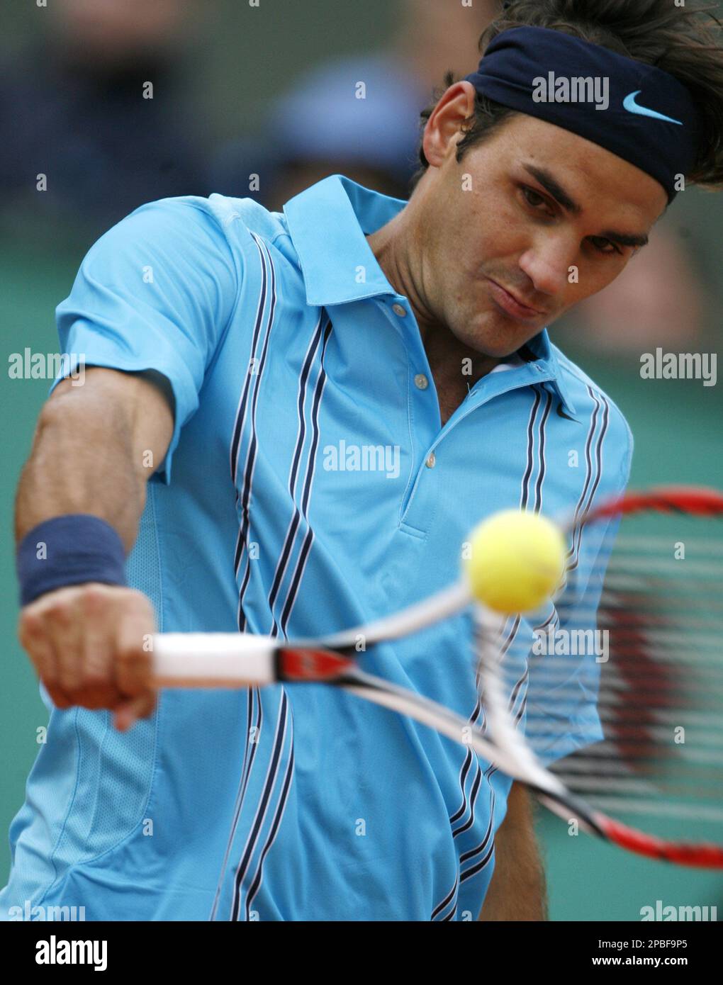 Switzerland's Roger Federer backhands to United States' Michael Russell ...