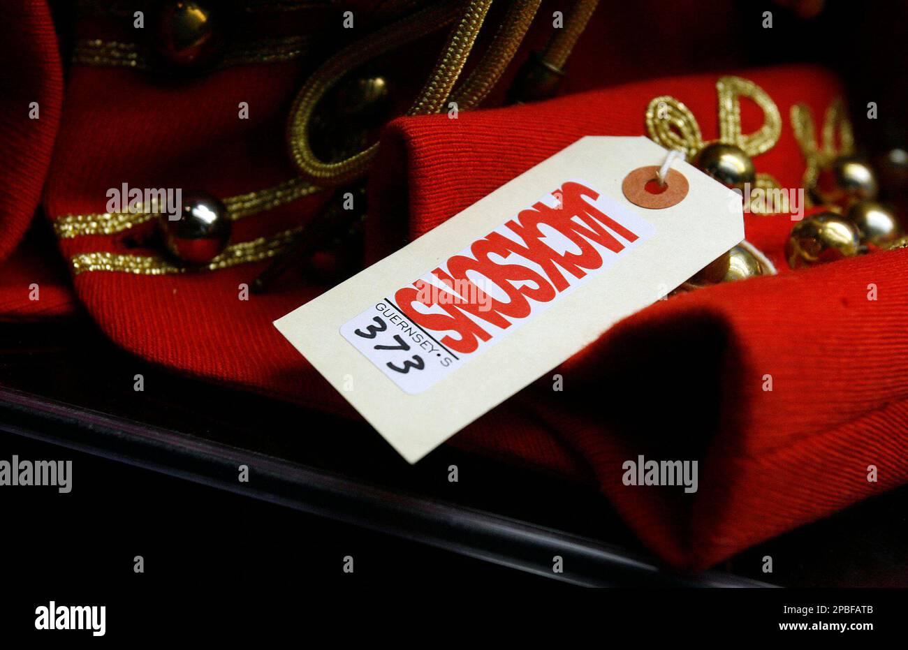 A tag hangs from Michael Jackson's Bill Whitten red and gold coat on ...