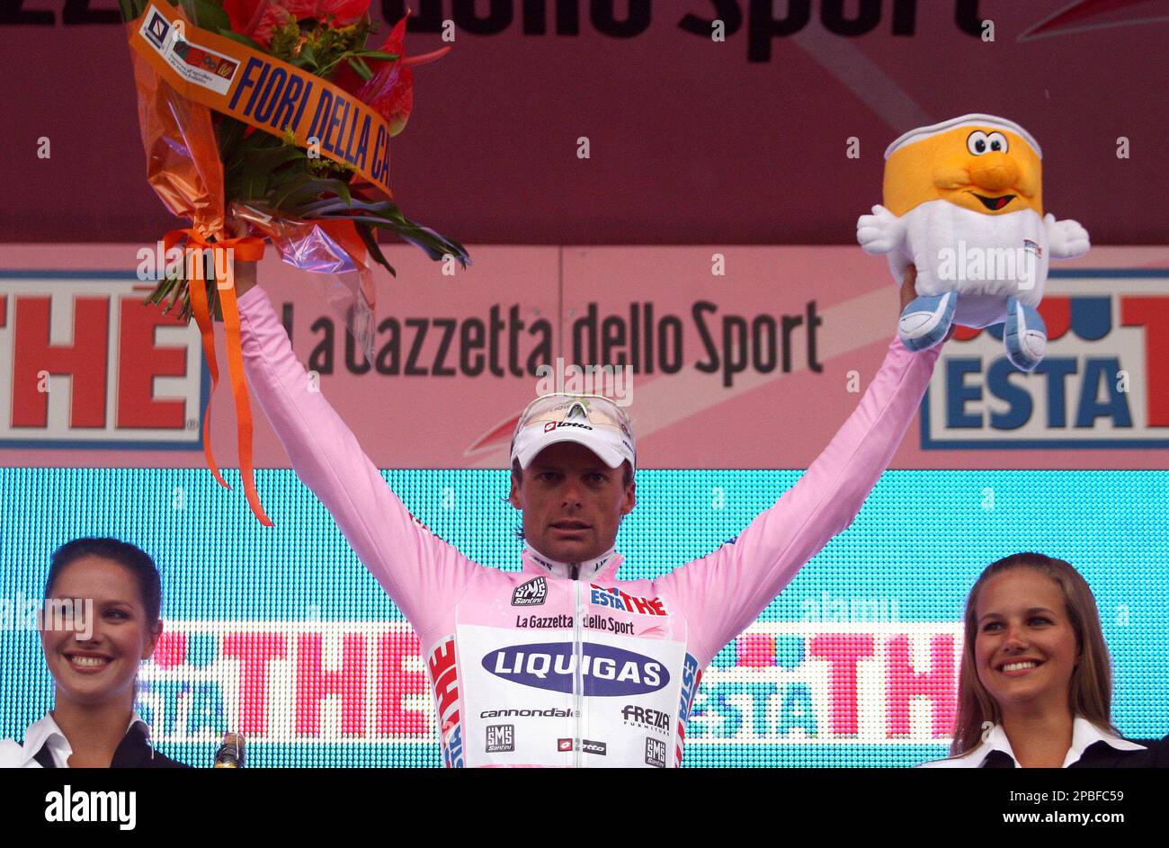 Italy's Danilo Di Luca celebrates on the podium after completing the ...