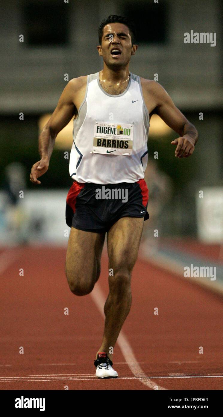 Juan Luis Barrios, from Mexico, hits the finish line to win the 5,000-meter race during the Road ...