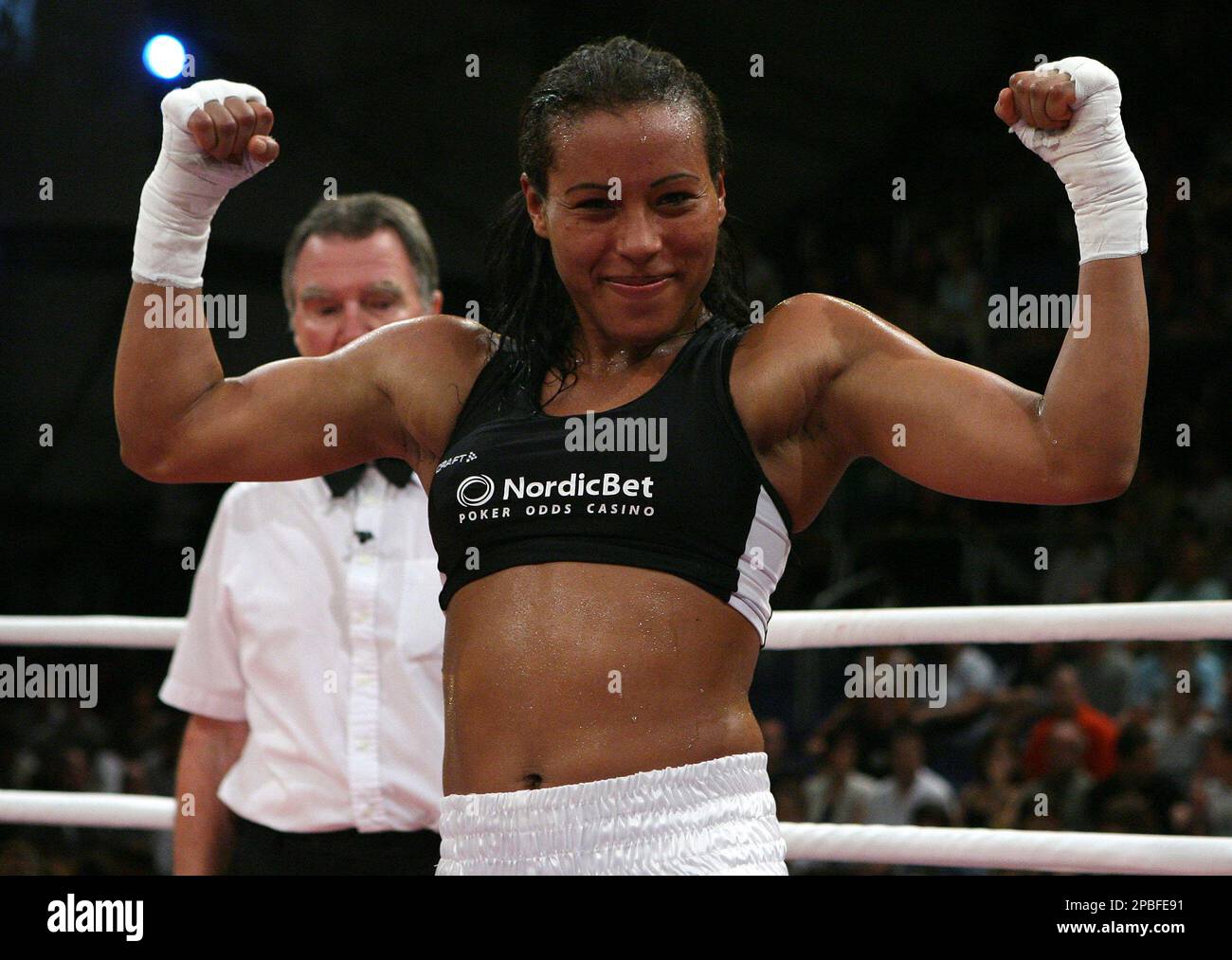 Boxer Cecilia Braekhus of Norway, celebrates after defeating Olga ...