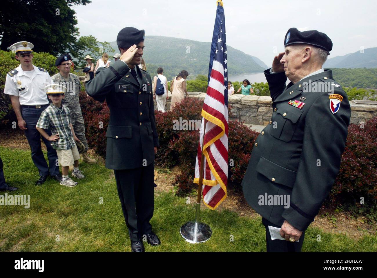 Second Lt. Daniel Palmer, left, salutes his grandfather retired Col ...