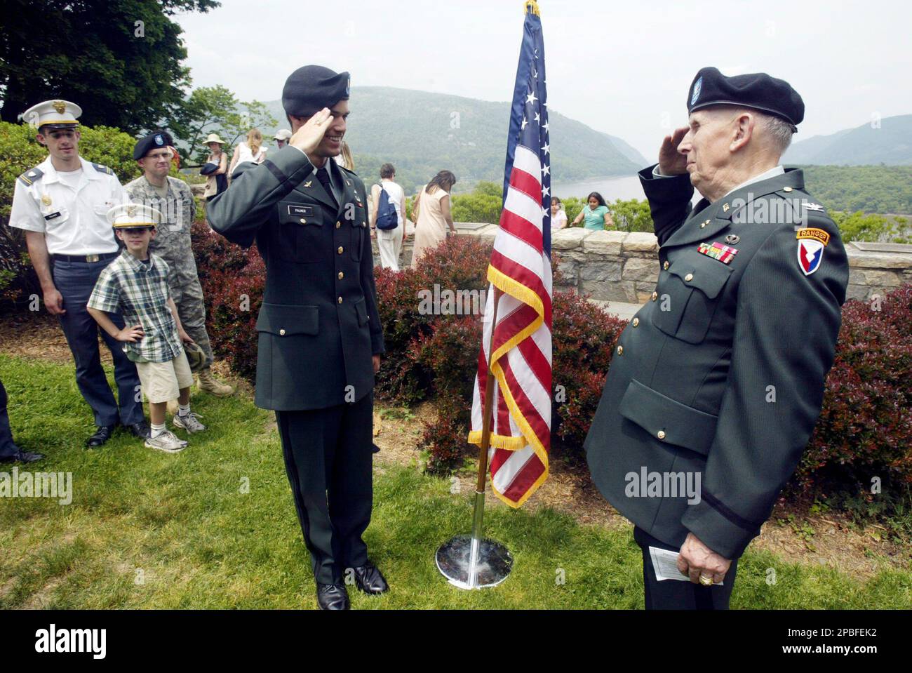 Second Lt. Daniel Palmer, center left, salutes his grandfather retired ...