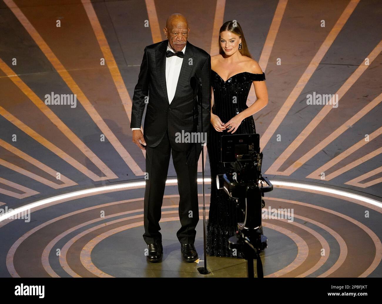 Morgan Freeman, left, and Margot Robbie speak about Warner Brothers 100 ...