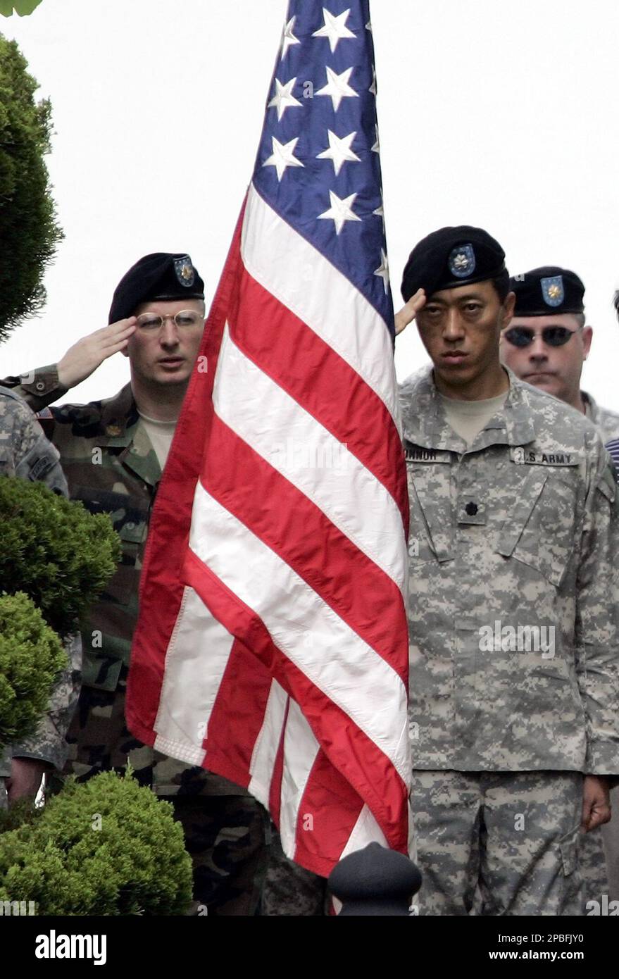 U.S. soldiers salute to their national flag during the Memorial Day ...