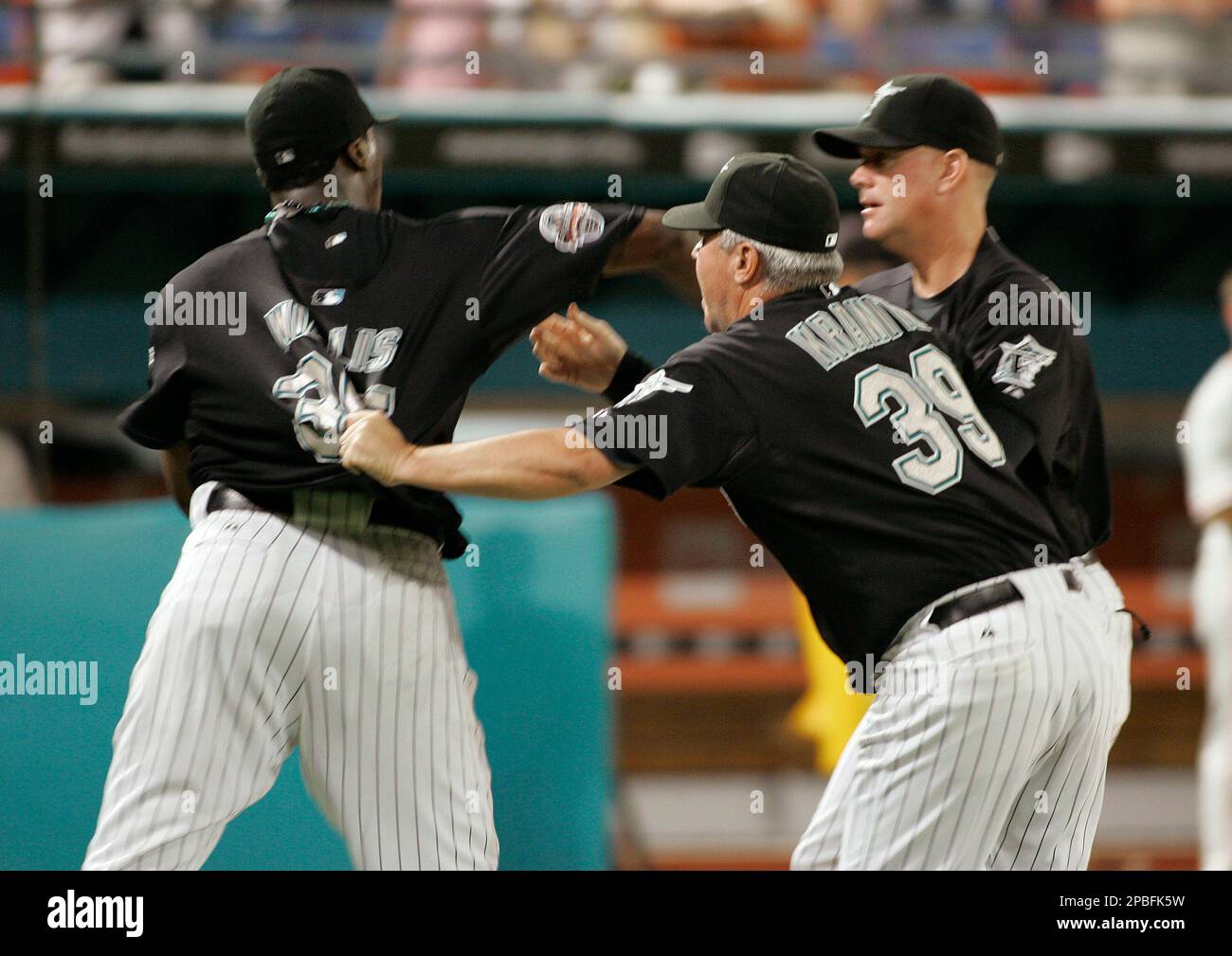 Florida Marlins pitching coach Rick Kranitz, center, and hitting coach ...