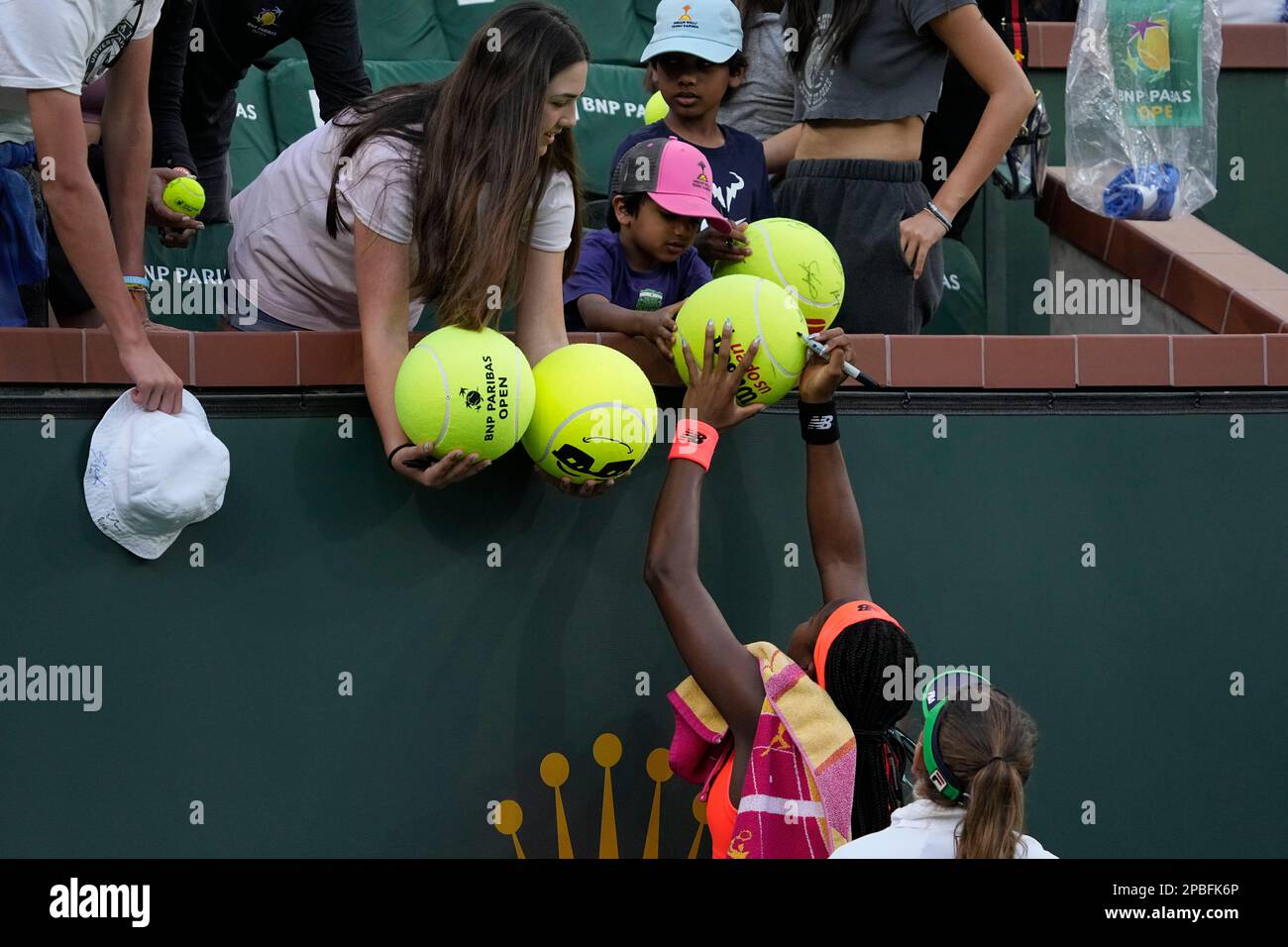 Coco Gauff signs autographs for fans after defeating Linda Noskova, of ...