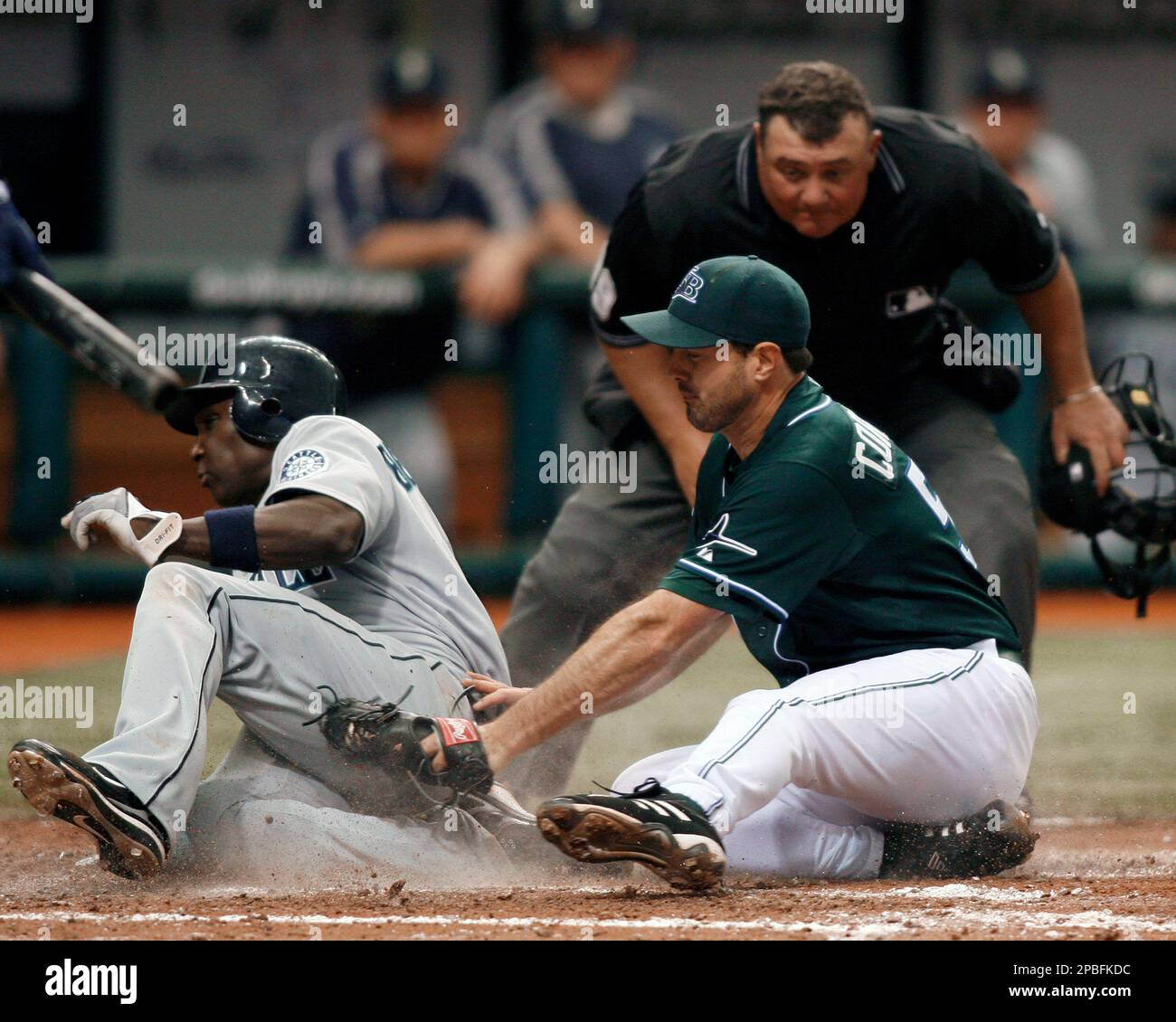 Tampa Bay Devil Rays relief pitcher Tim Corcoran, right, applies a late ...
