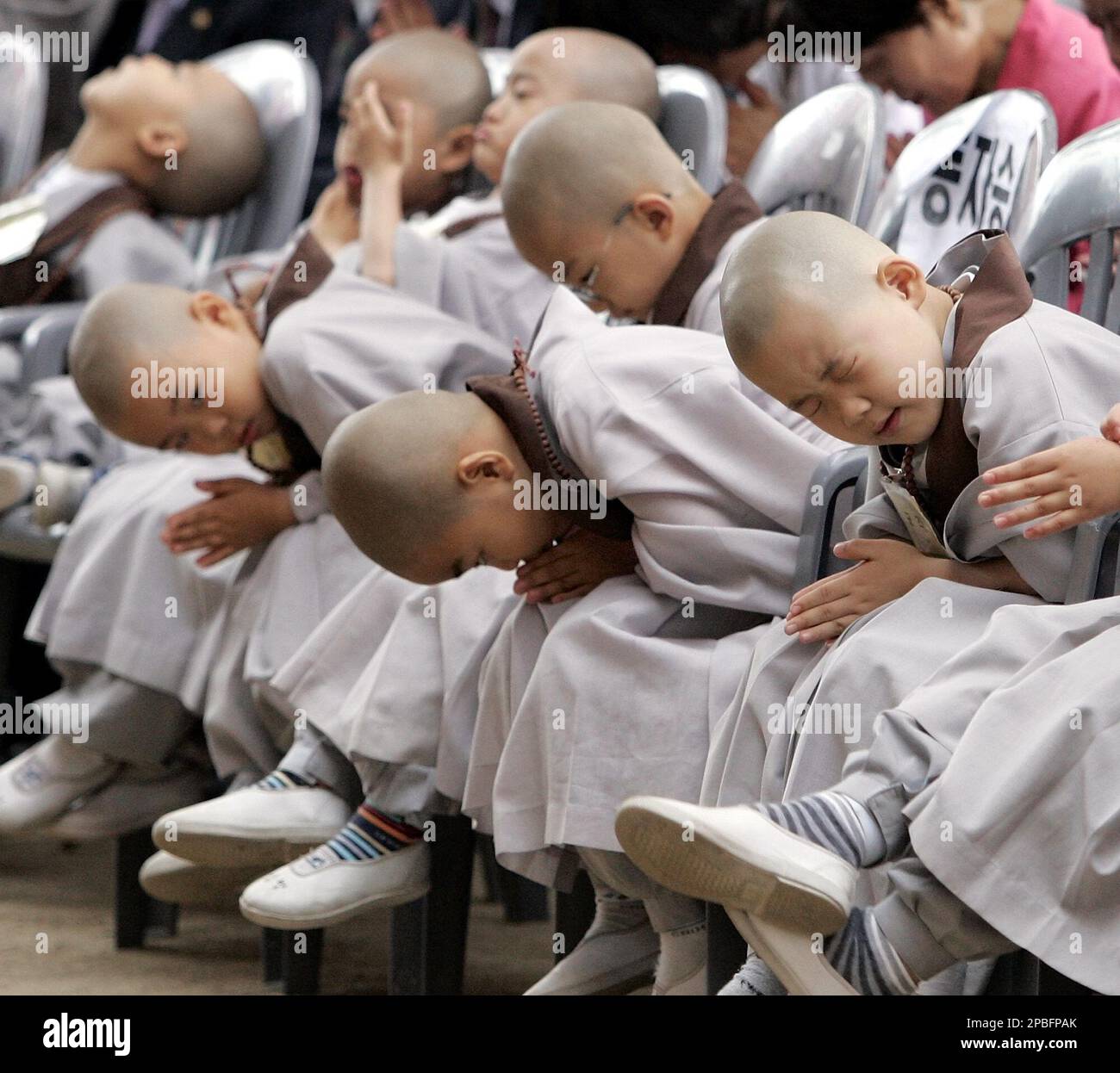 South Korean young monks pray during a service to celebrate the 2,551st ...