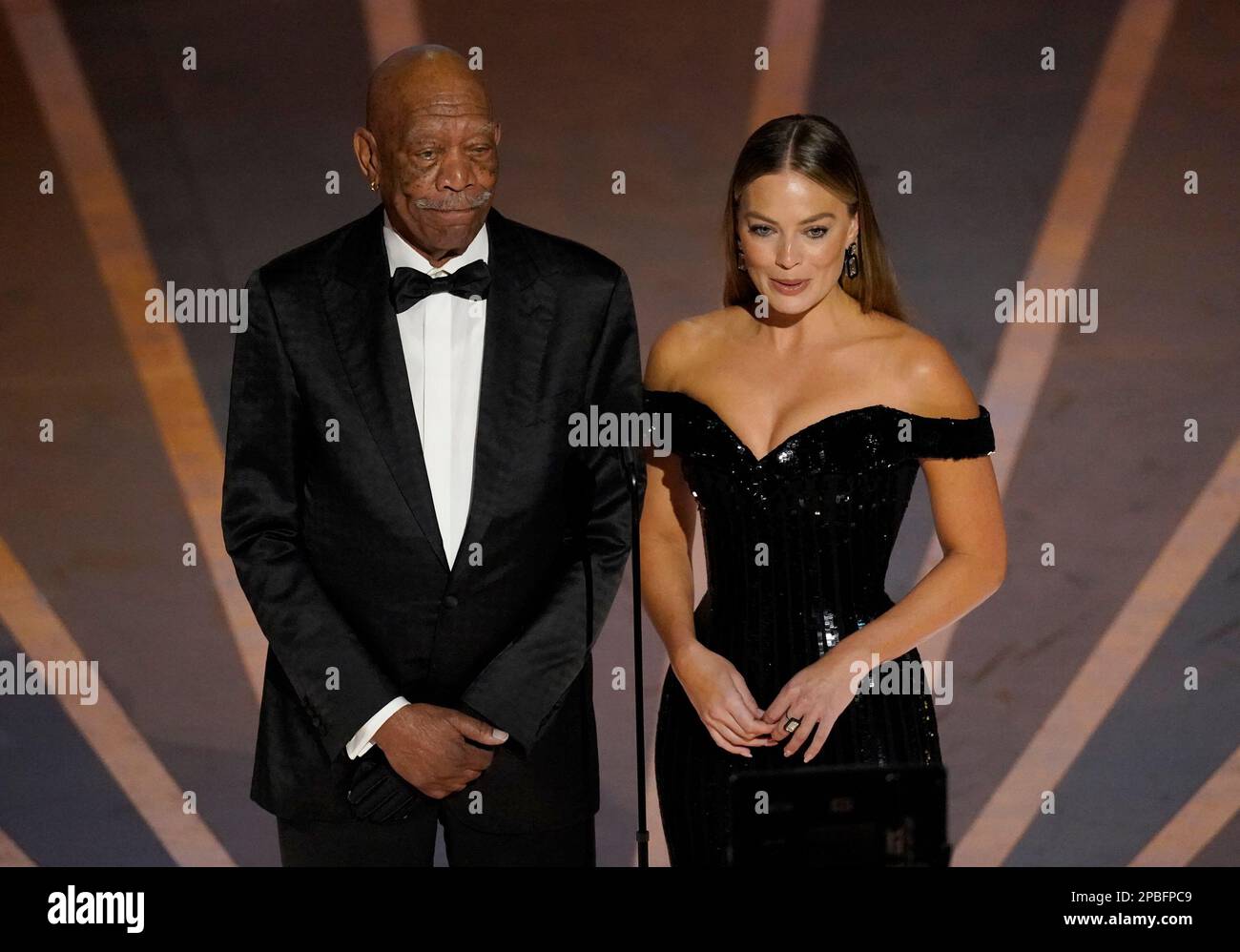 Morgan Freeman, left, and Margot Robbie speak about Warner Brothers 100 ...