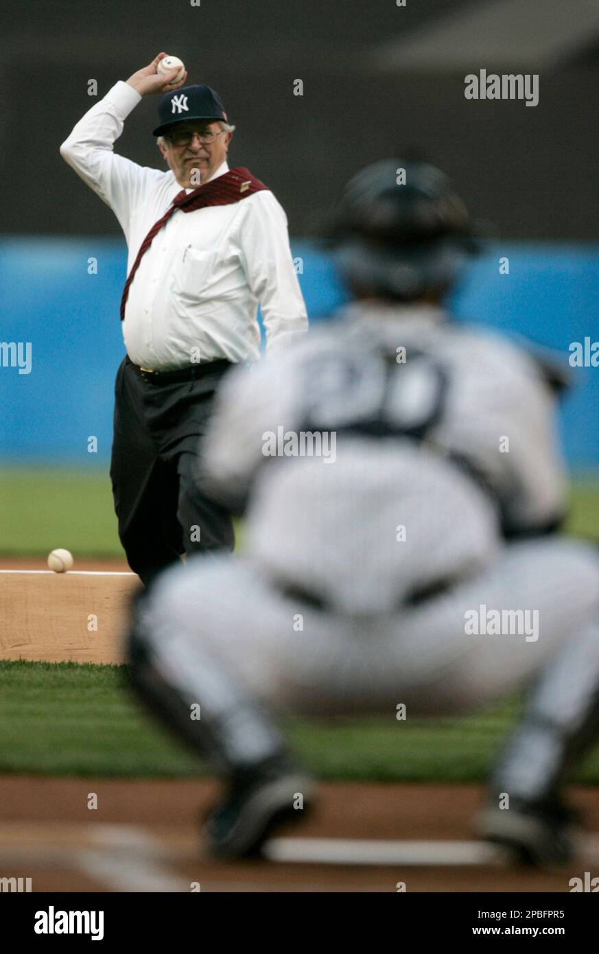 Virginia Tech president Dr. Charles Steger throws out the ceremonial ...