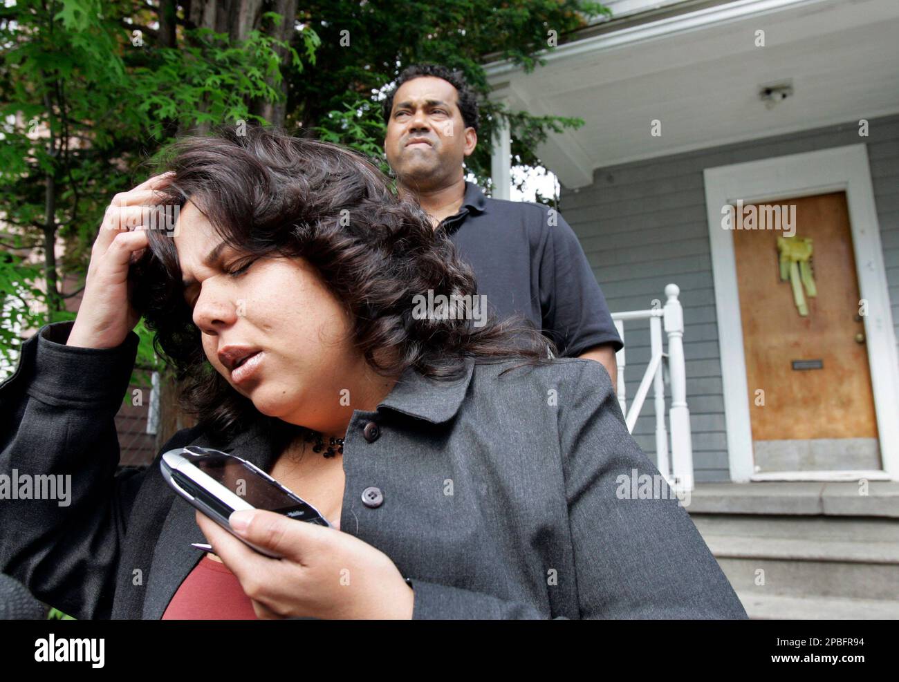 Family friends, Wendy Luzon and her husband Raul Polanco, react as she ...
