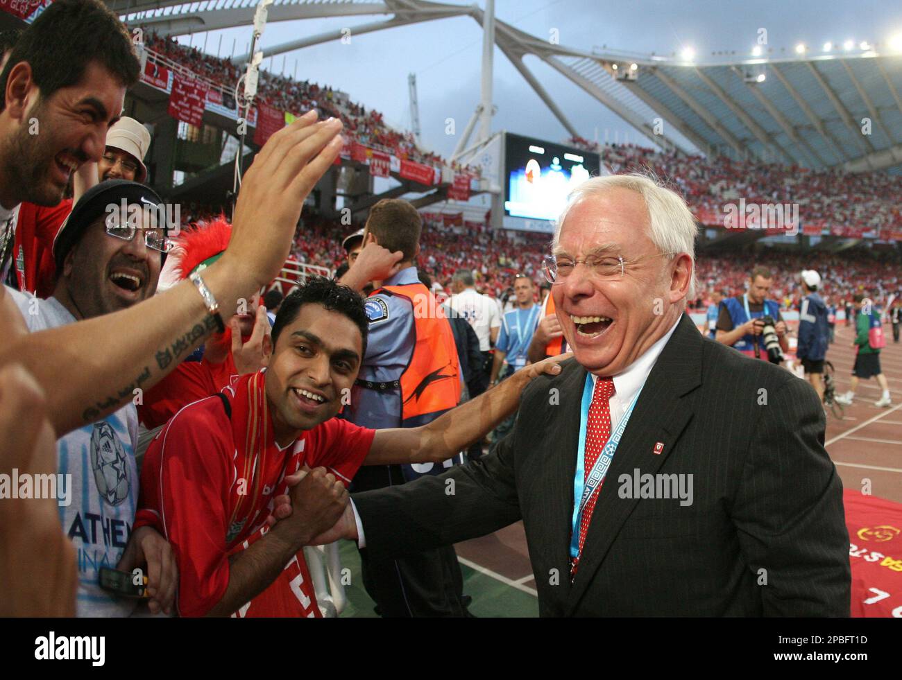Liverpool soccer team owner George Gillett Jr. laughs as he is greeted ...