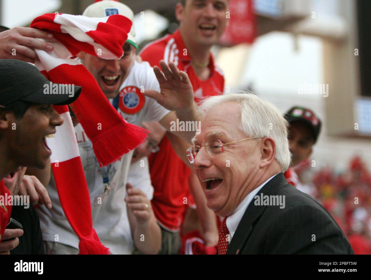 Liverpool soccer team owner George Gillett Jr. laughs as he is greeted ...