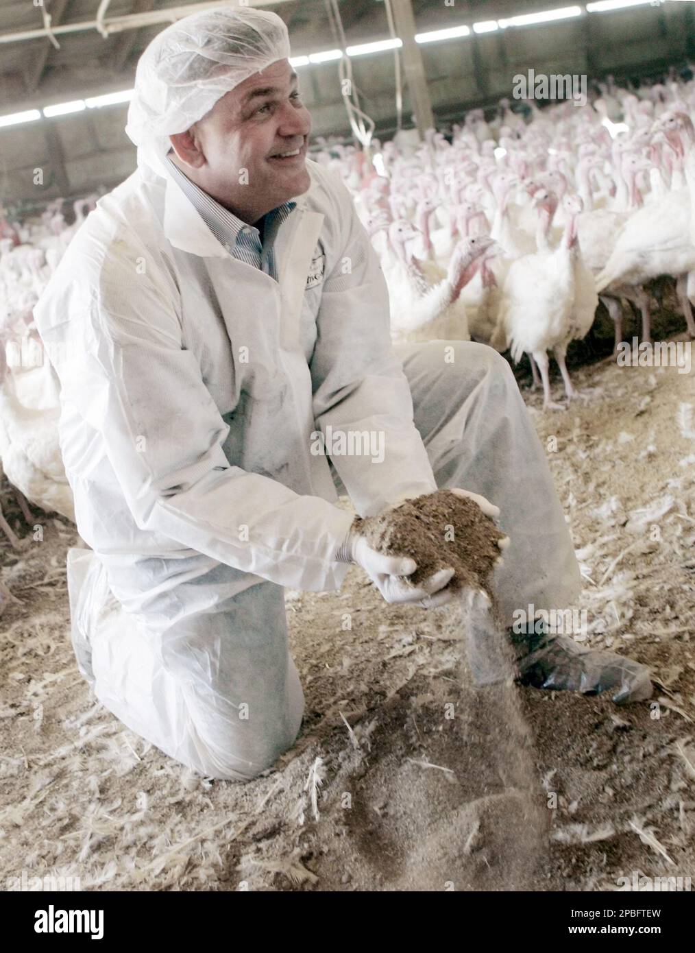 Greg Langmo holds a new source of alternative energy, a mix of turkey ...