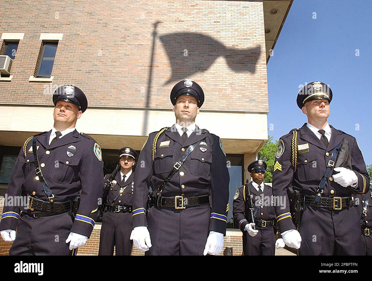 New Britain Police Honor guard officers from left, John Flynn, Paul Bak ...