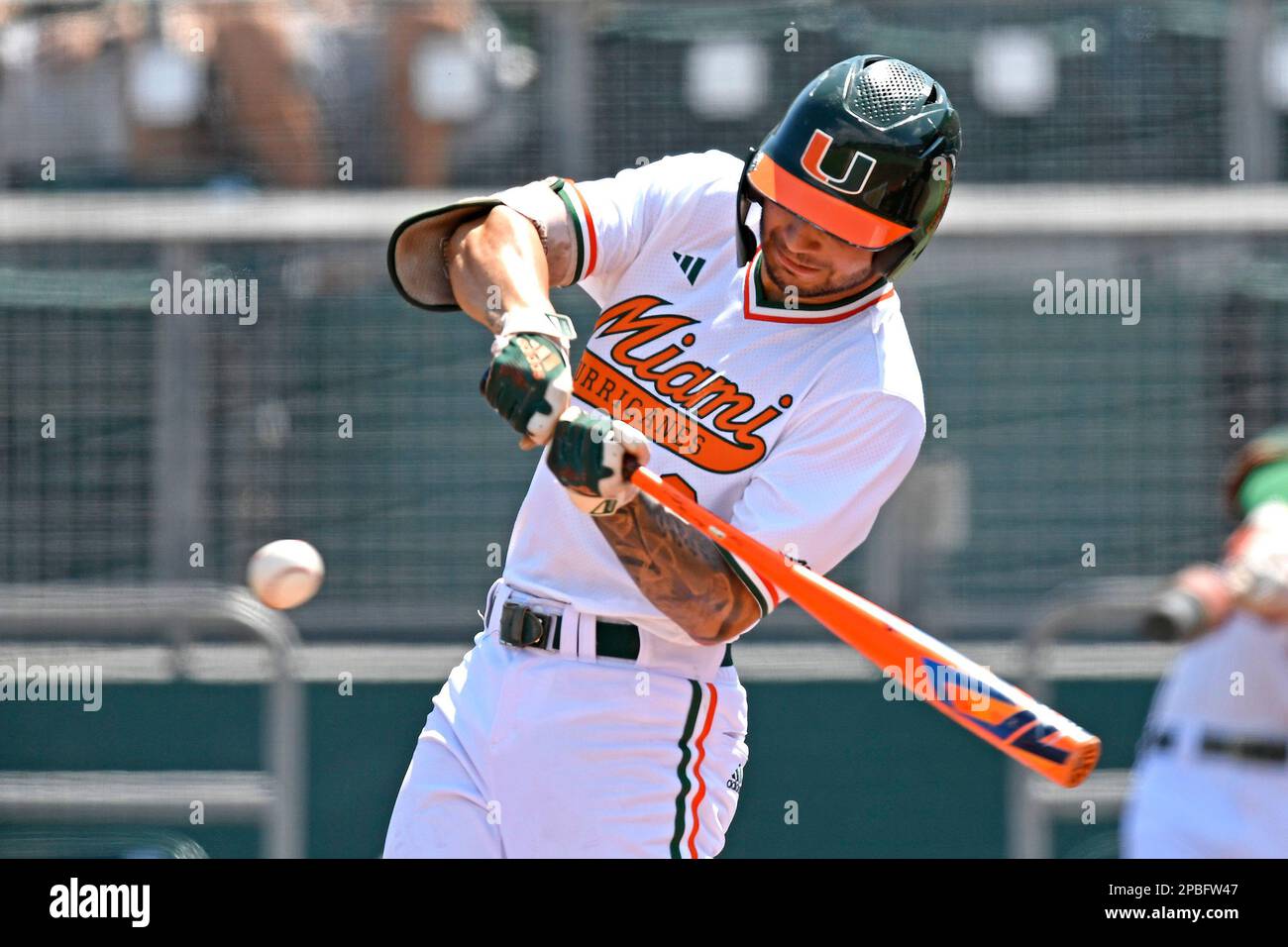 CORAL GABLES, FL - MAR 12: Miami infielder CJ Kayfus (2) bats in the ...