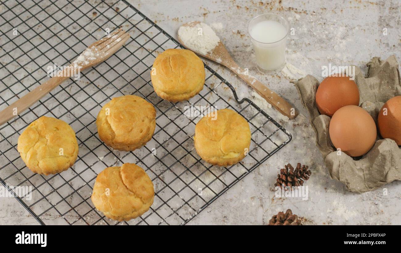 a traditional cake from Indonesia called kue sus filled with cream ...