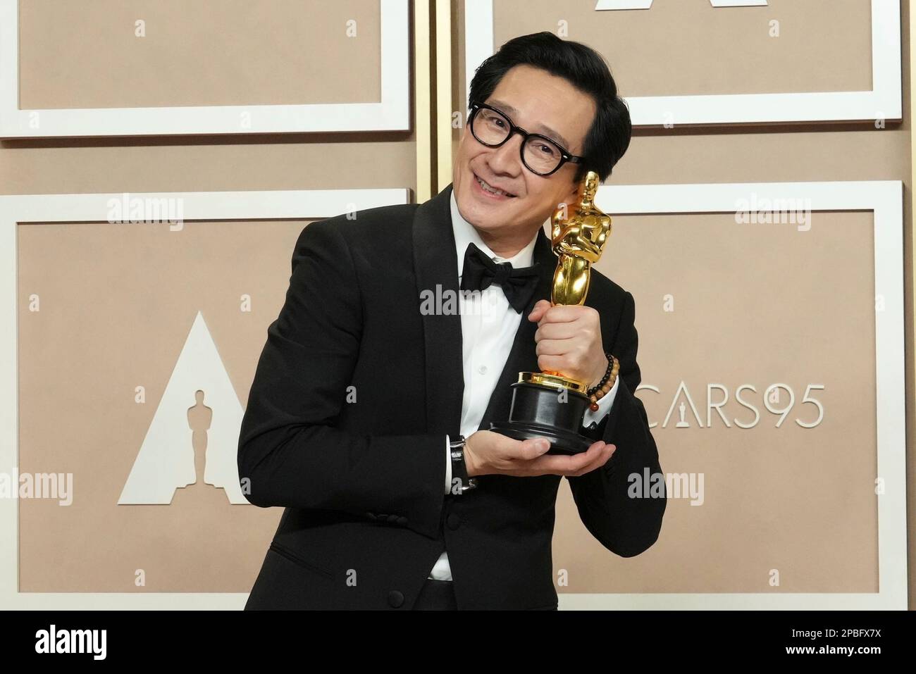 Ke Huy Quan, winner of the award for best performance by an actor in a ...