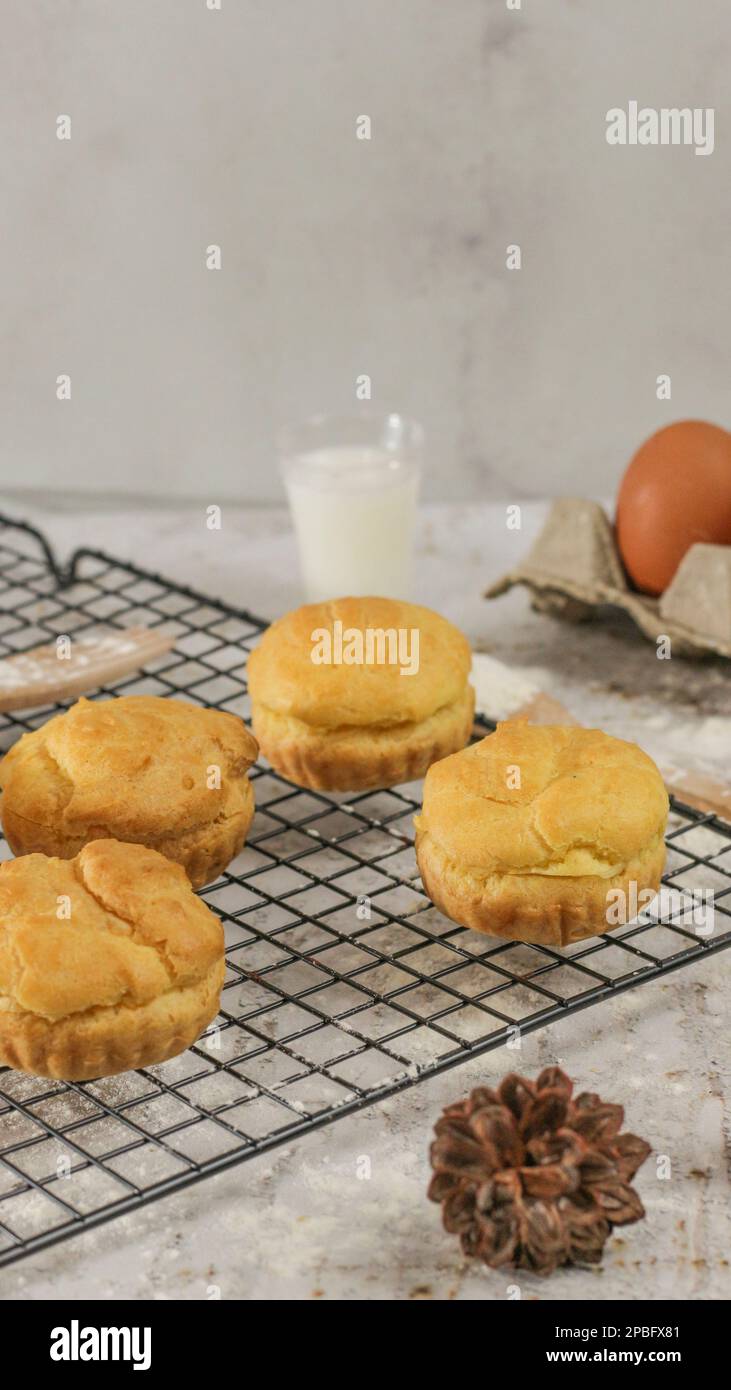 a traditional cake from Indonesia called kue sus filled with cream ...