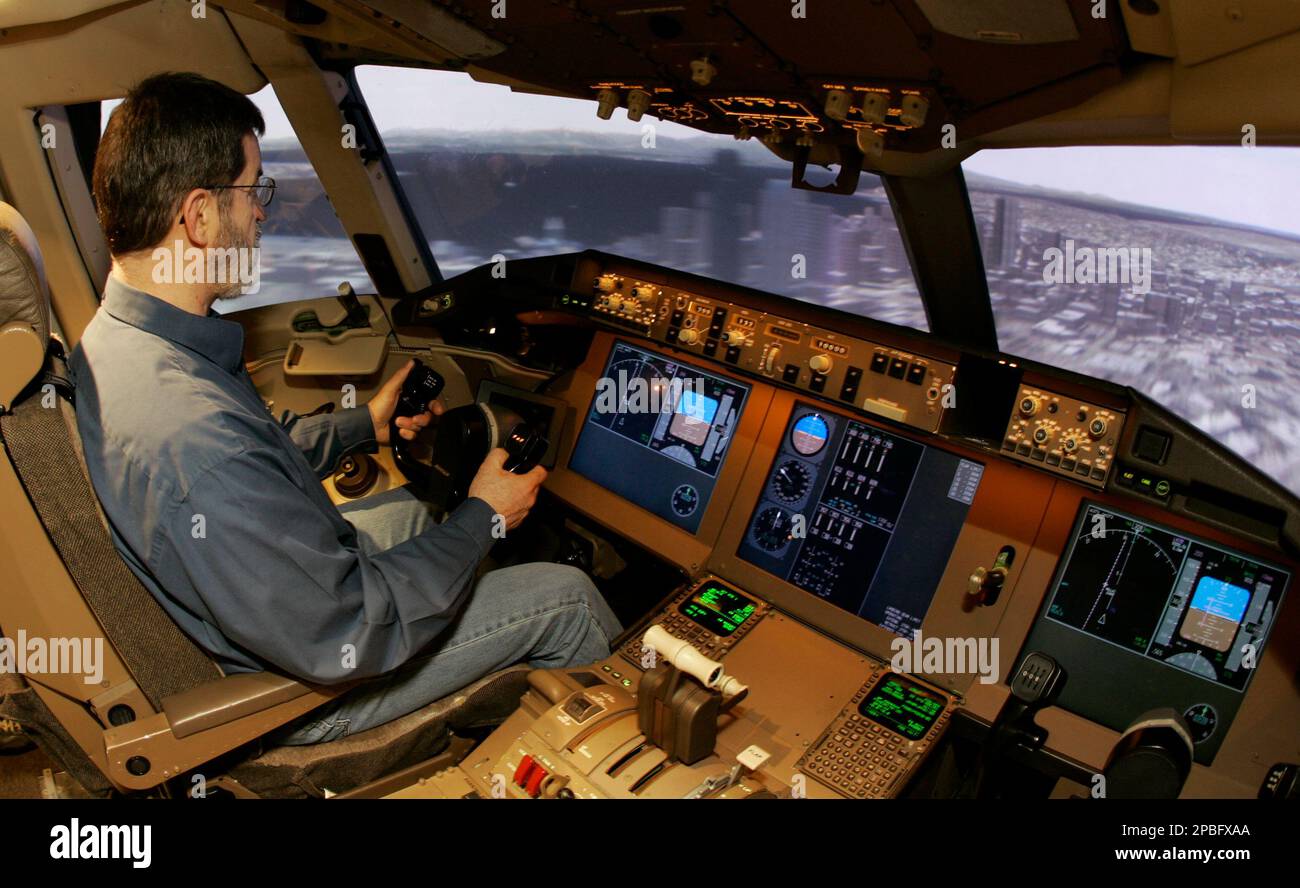 Boeing Co. engineer Jack Butcher flies a Boeing flight simulator as ...
