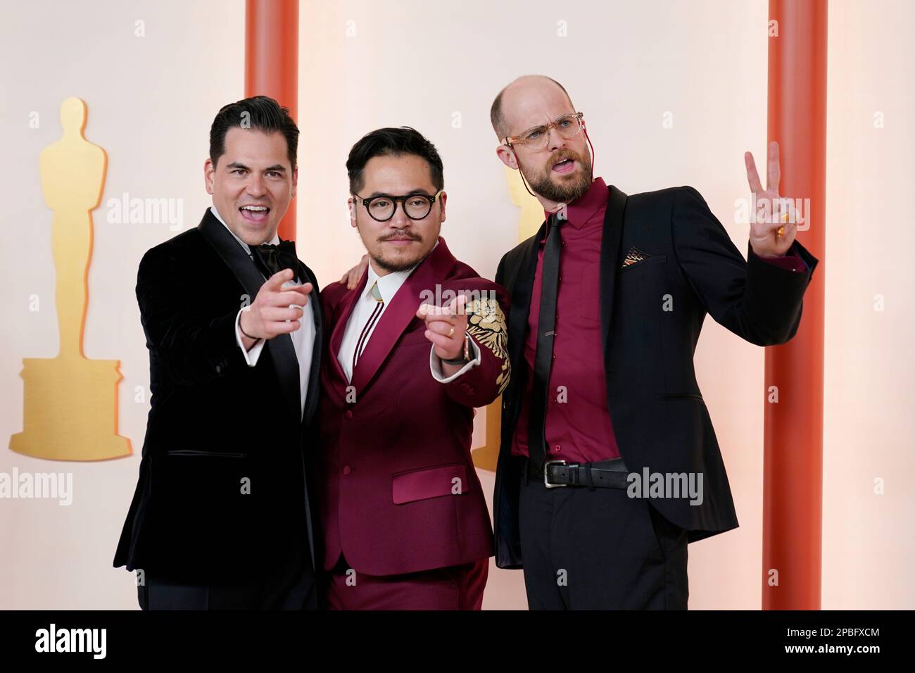 Jonathan Wang, from left, Daniel Kwan and Daniel Scheinert arrive at ...