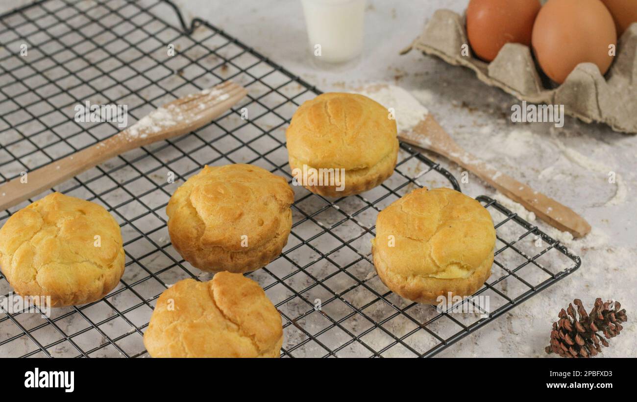 a traditional cake from Indonesia called kue sus filled with cream ...