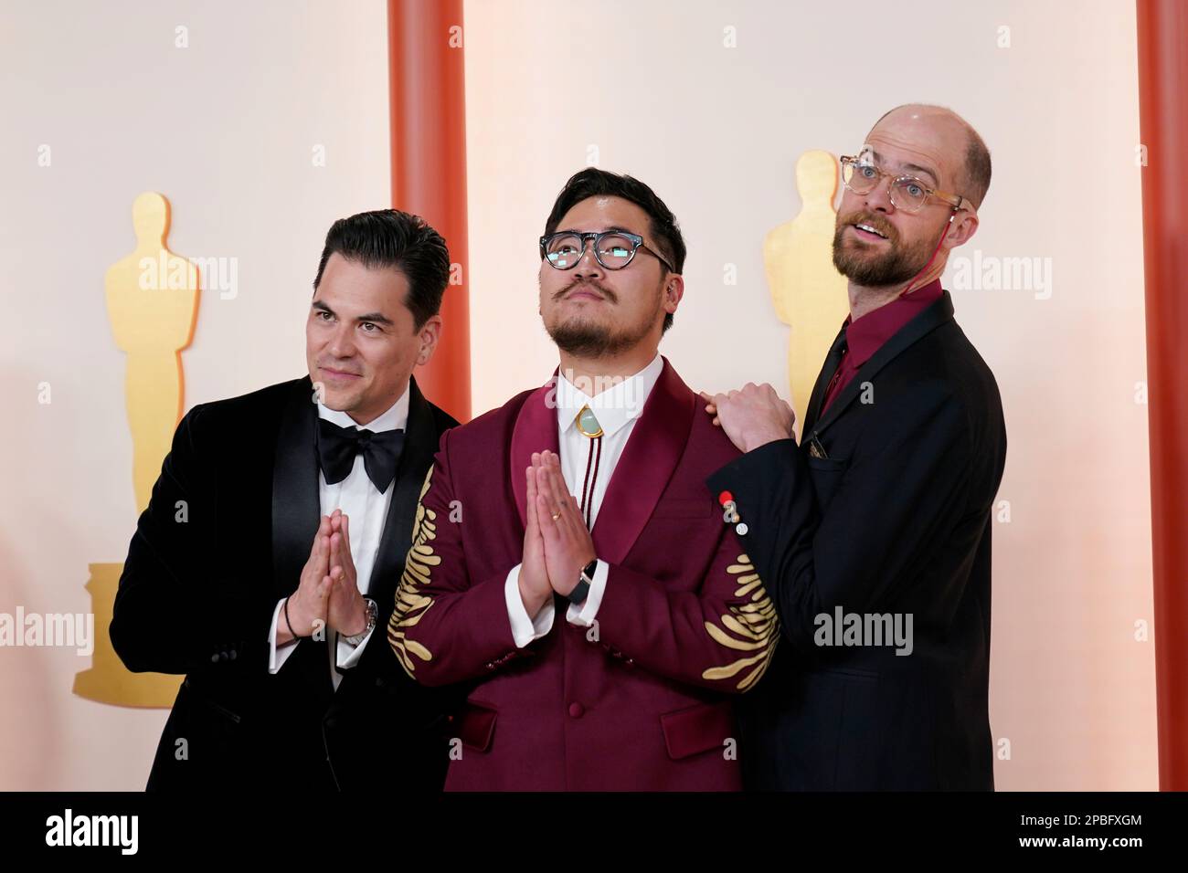 Jonathan Wang, from left, Daniel Kwan and Daniel Scheinert arrive at ...