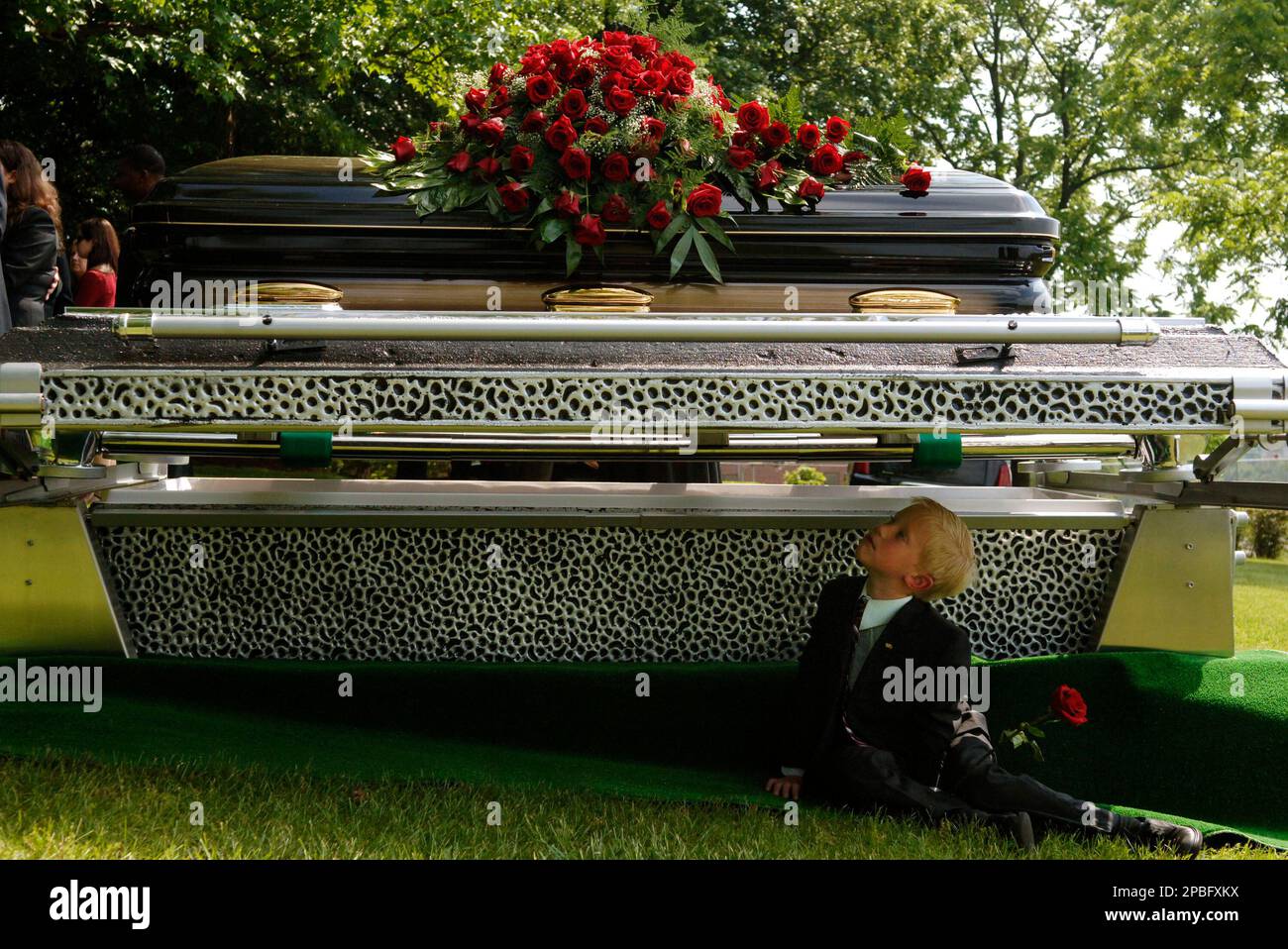 Nicholas Falwell, grandson of Rev. Jerry Falwel , rests in the shade of ...