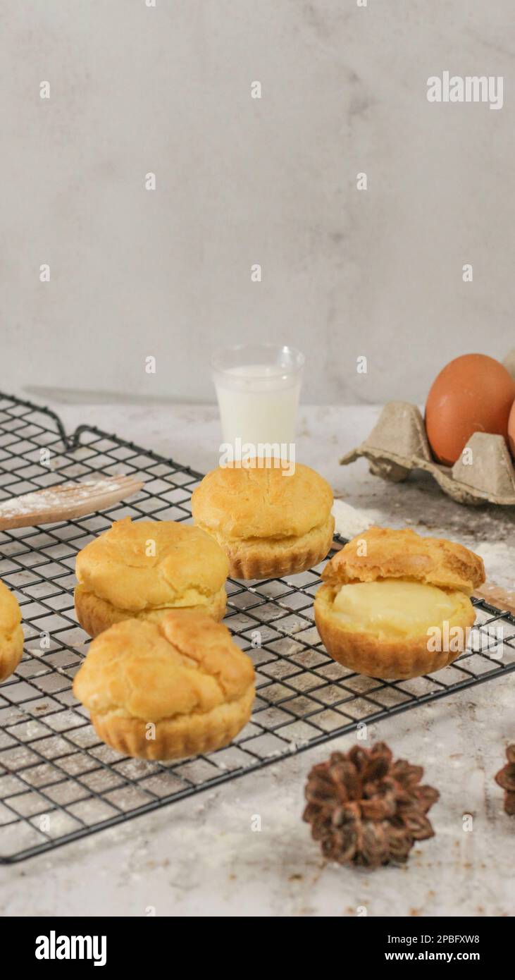 a traditional cake from Indonesia called kue sus filled with cream ...