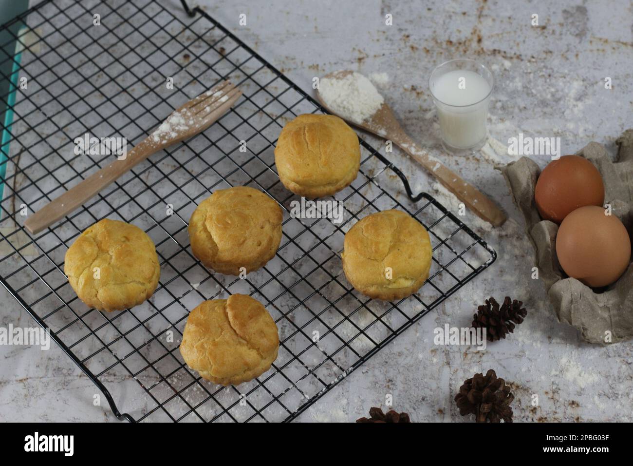 a traditional cake from Indonesia called kue sus filled with cream ...