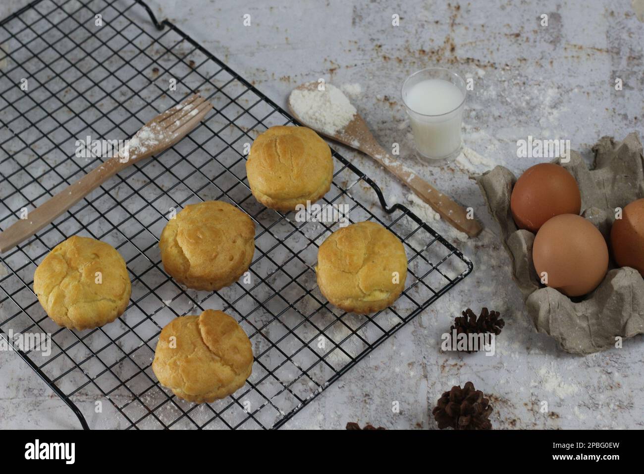 a traditional cake from Indonesia called kue sus filled with cream ...