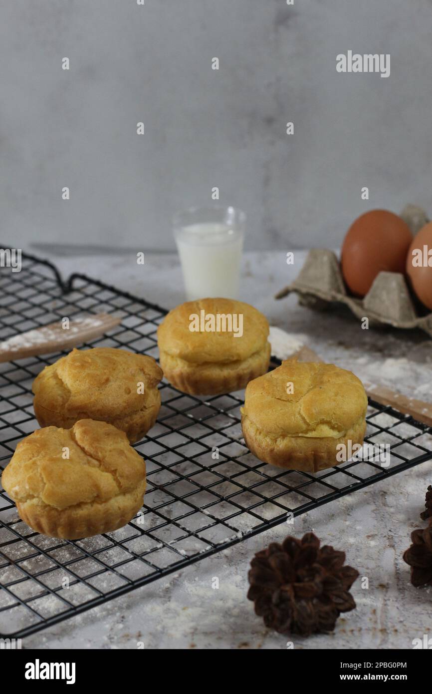 a traditional cake from Indonesia called kue sus filled with cream ...